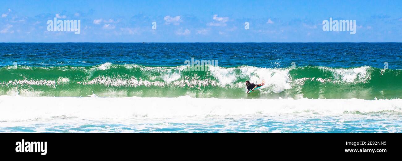 Caucasian boogie boarder on a perfect wave at a beach Stock Photo - Alamy