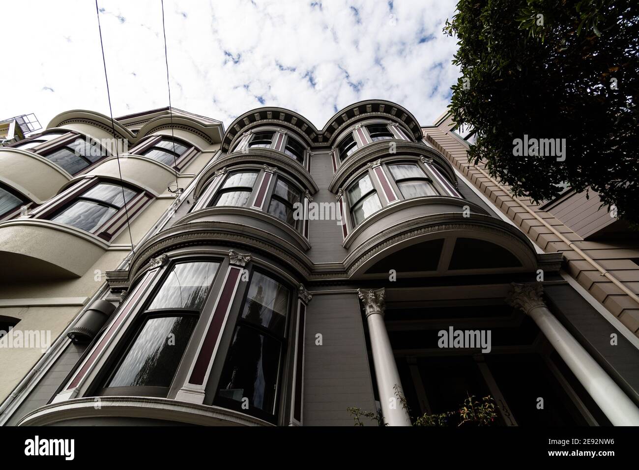 Low angle shot of the modern house with a cloudy background Stock Photo ...