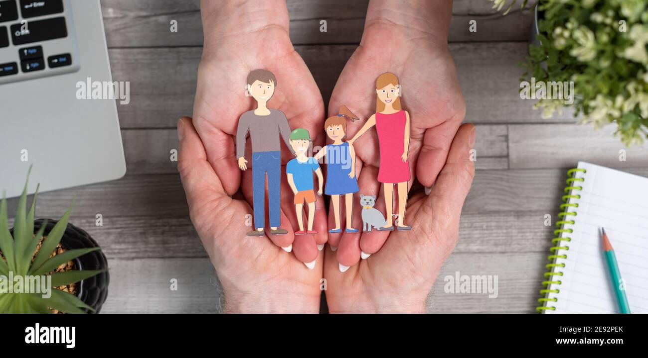 Concept of family insurance with paper family in hands Stock Photo - Alamy