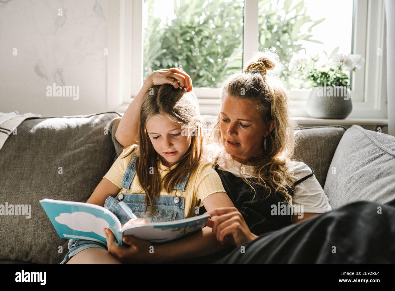 Daughter writing hi-res stock photography and images - Alamy