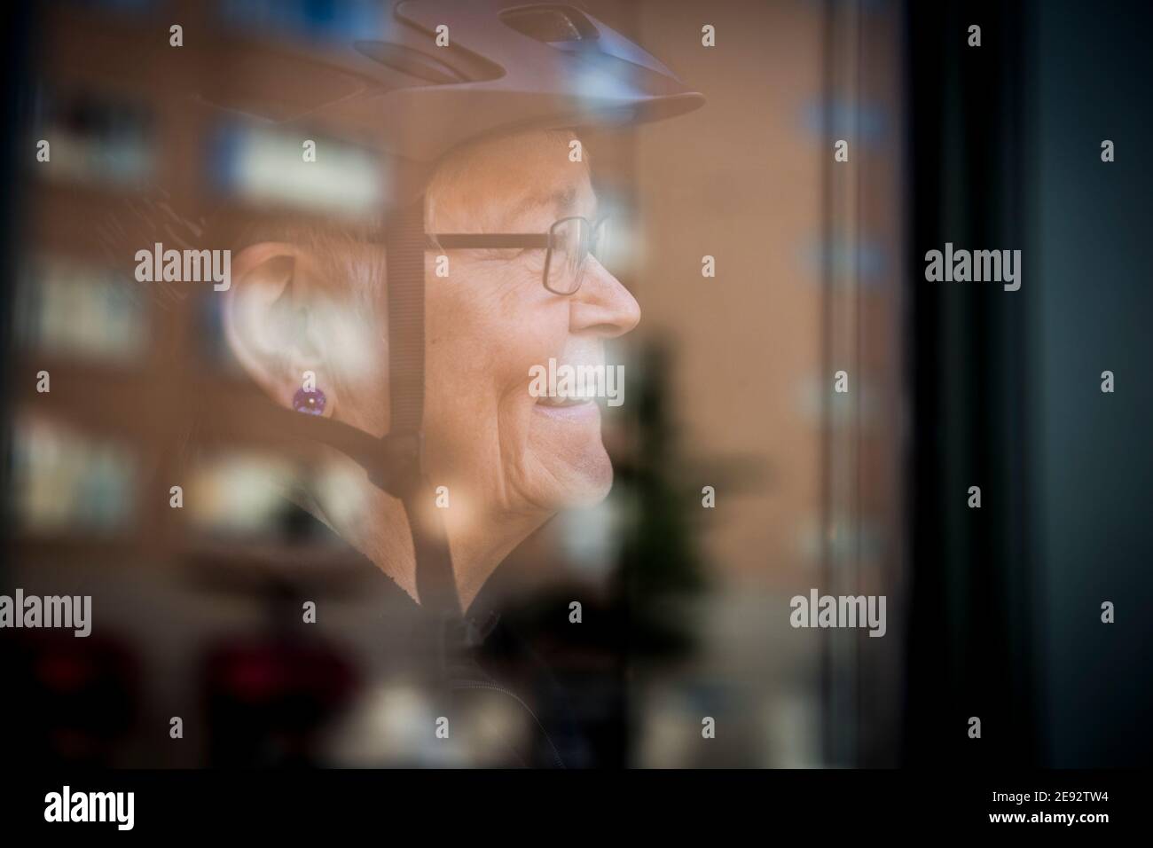 Smiling woman home window hi-res stock photography and images - Alamy