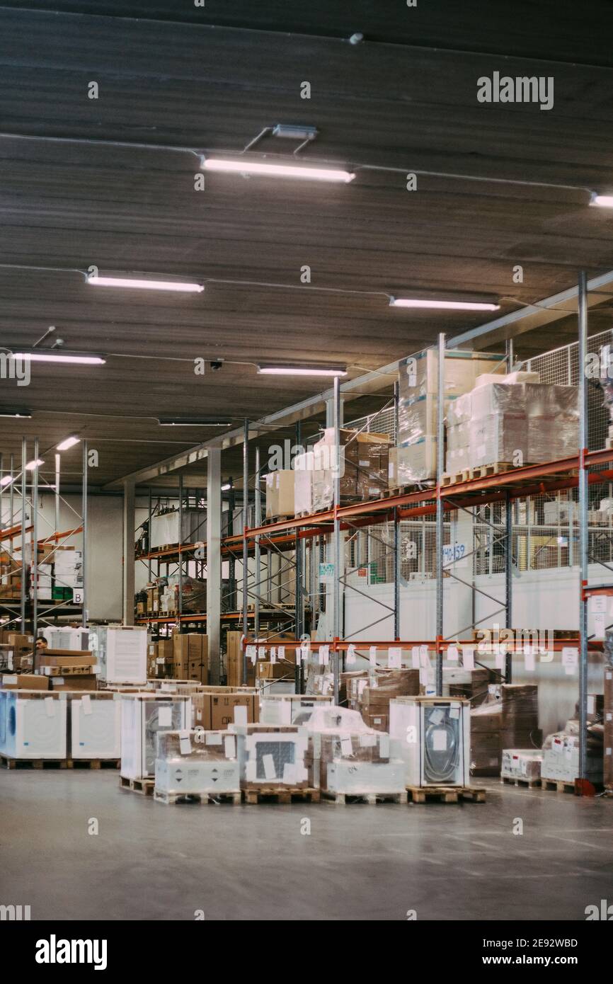 Box container and packages in distribution warehouse Stock Photo - Alamy