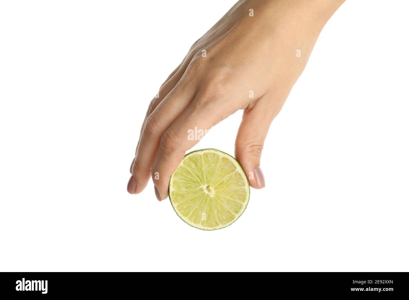 Female hand hold half of lime, isolated on white background Stock Photo ...