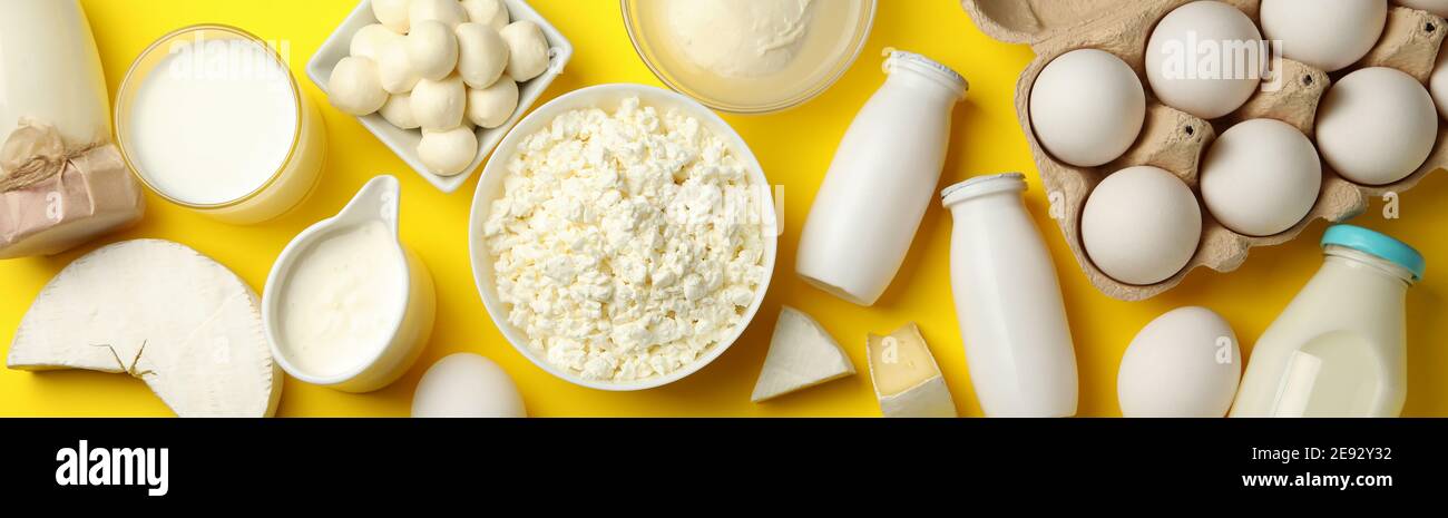 Different fresh dairy products on yellow background, top view Stock ...
