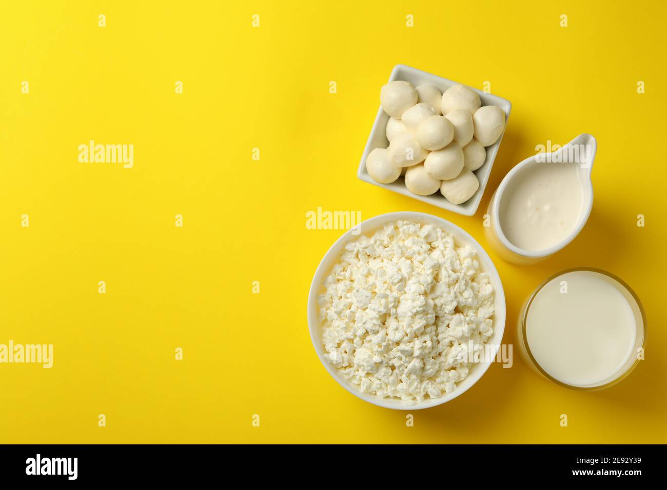 Different fresh dairy products on yellow background, top view Stock ...
