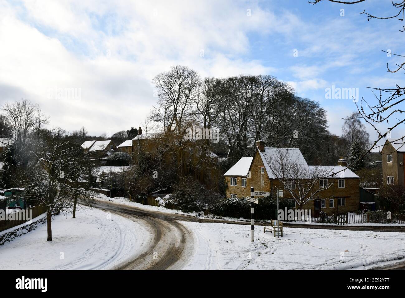 Hook Norton Village with Snowfall Stock Photo - Alamy