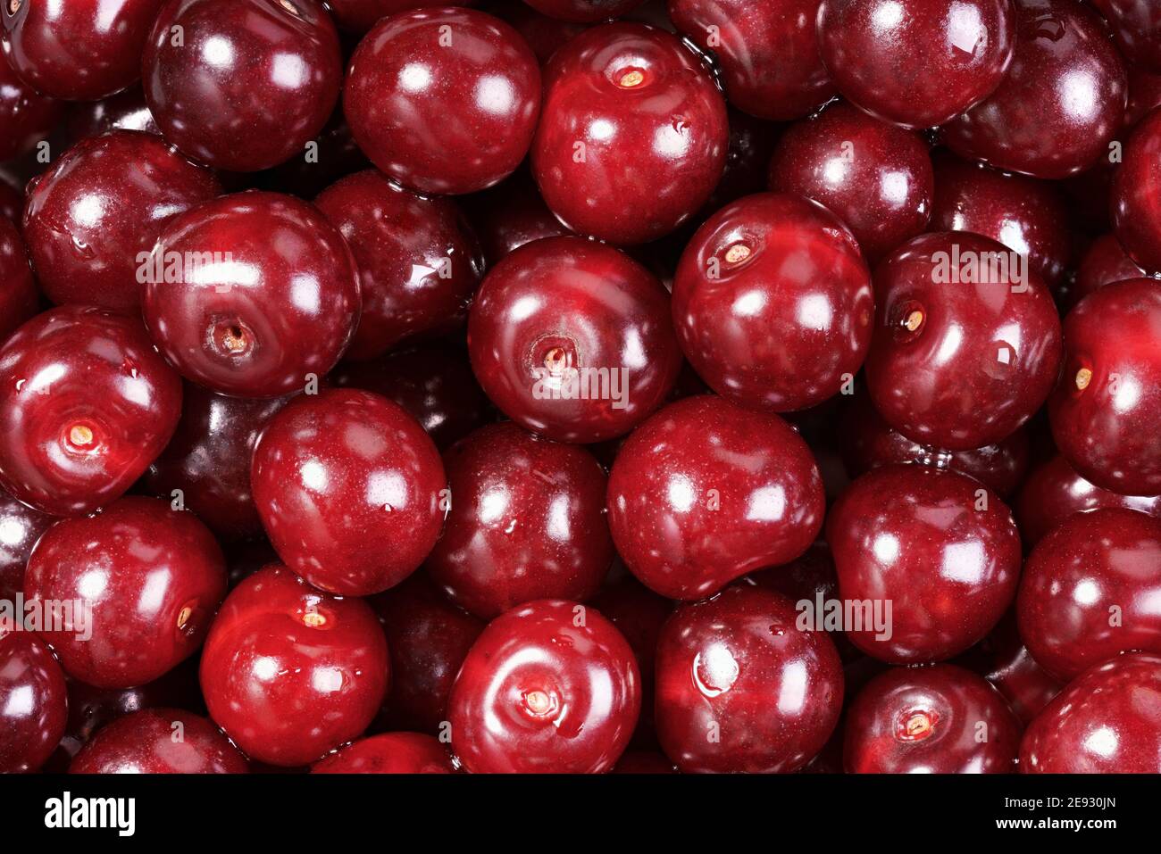 Close-up of pile of ripe cherries. Full screen of ripe red cherries ...