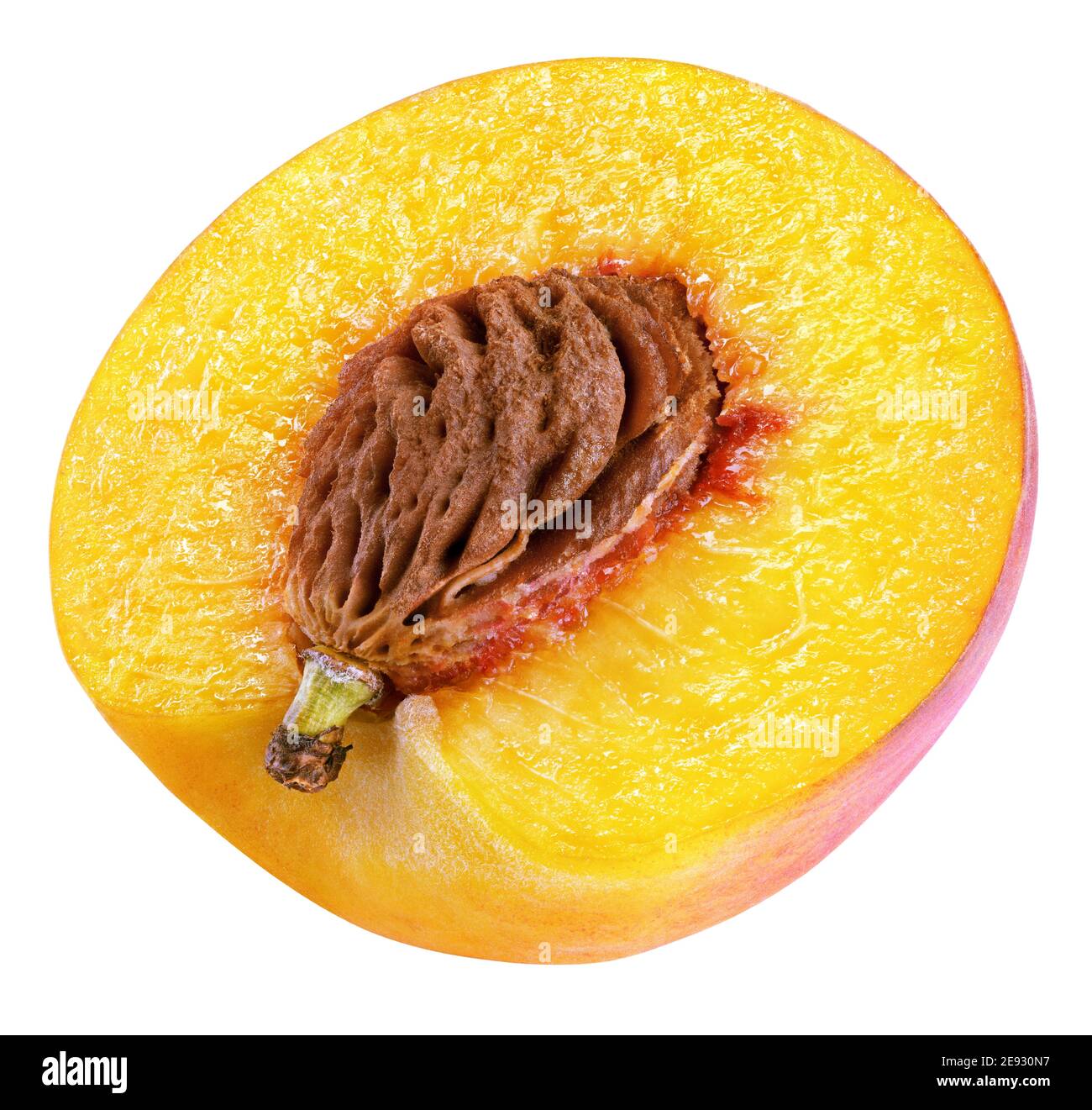 Ripe half peach fruit with nut isolated on white background with ...