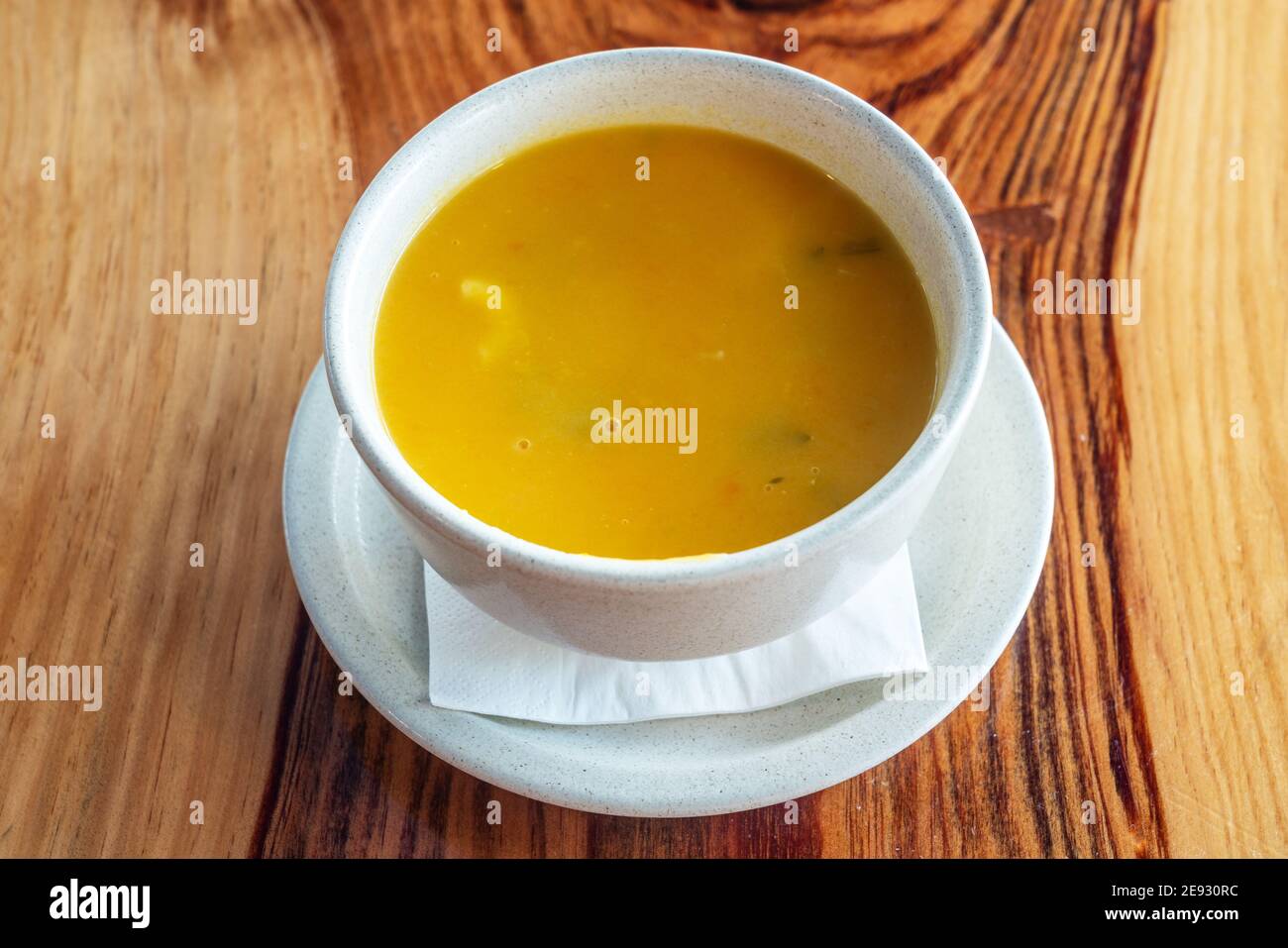 Simple traditional orange colored portuguese soup with vegetables and ...