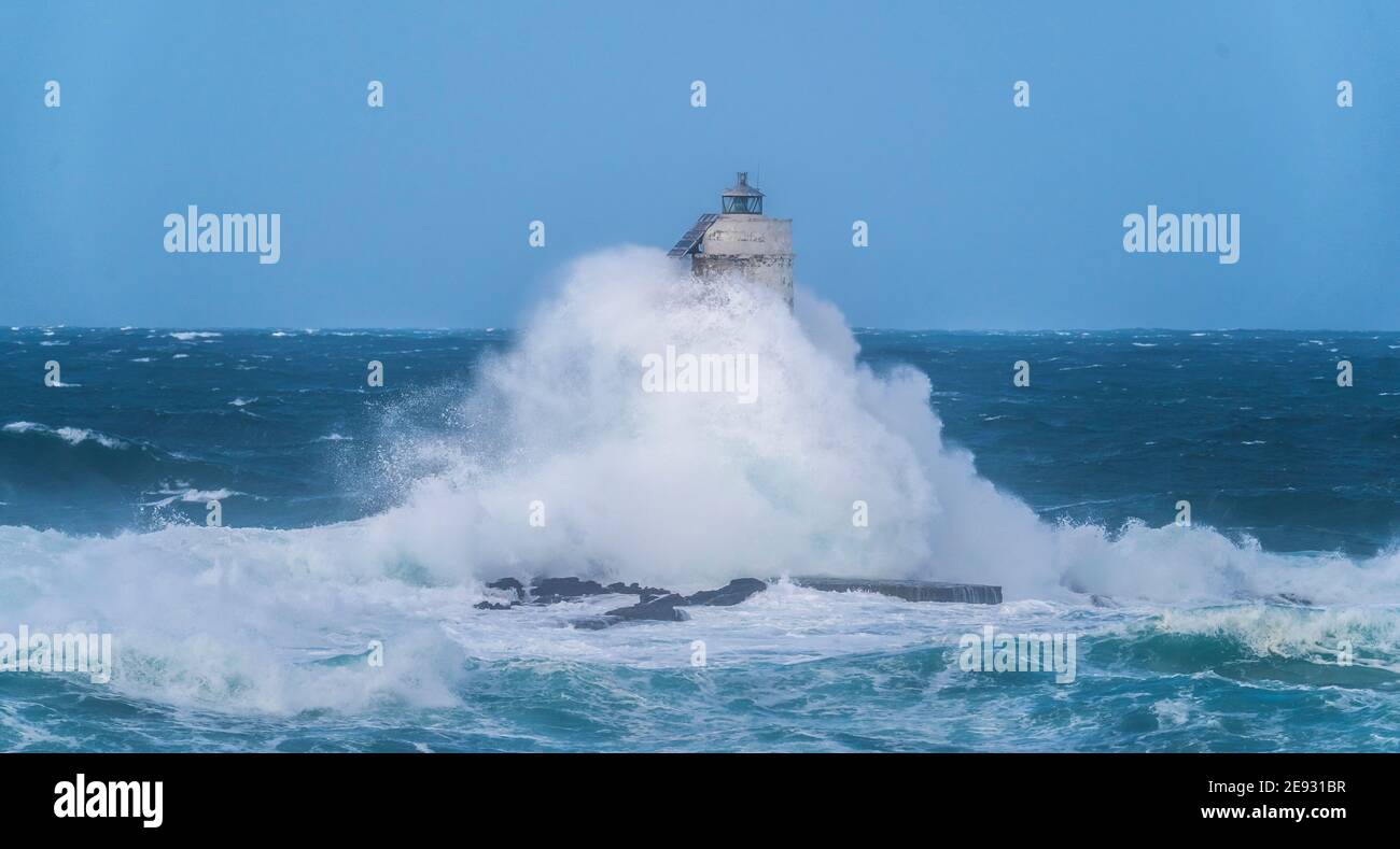 rain and rough sea behind the lighthouse of the boat-eater, calasetta ...
