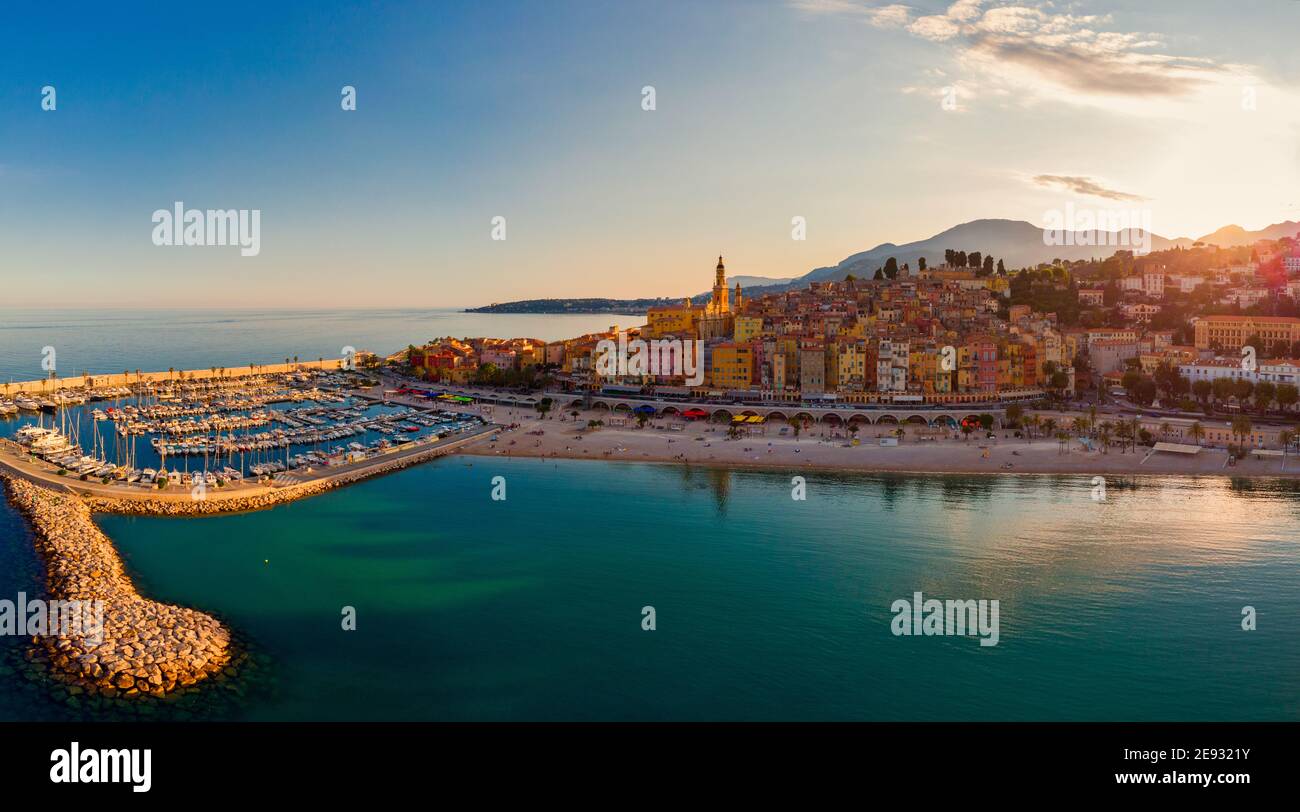 Sand beach beneath the colorful old town Menton on french Riviera ...