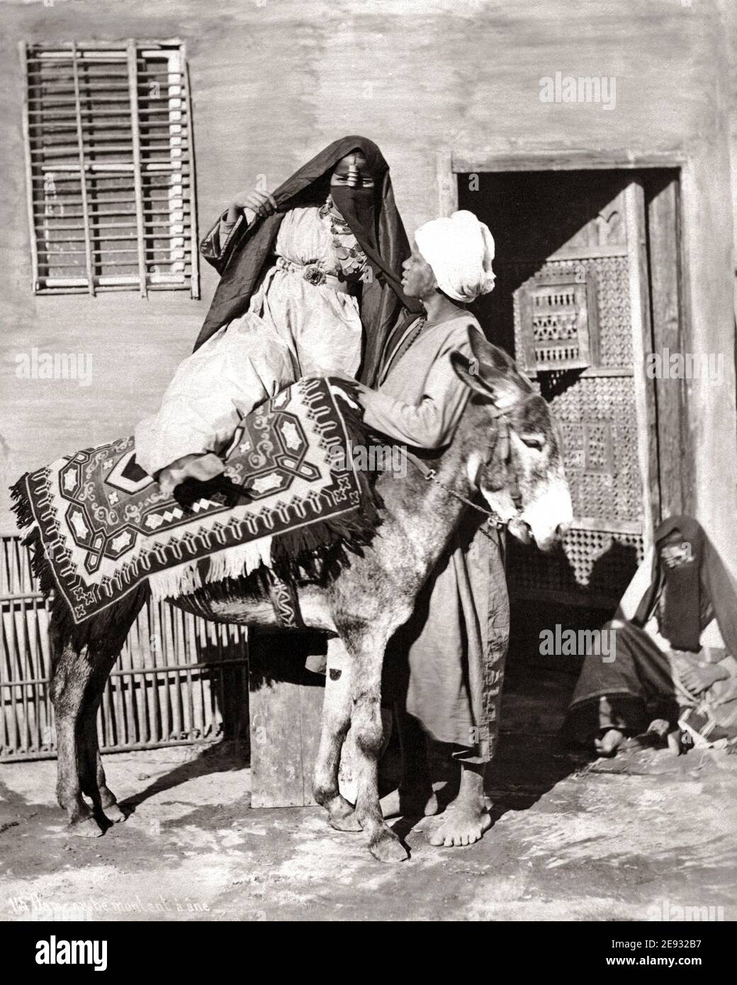 Late 19th century photograph - Veiled Woman Mounting Donkey, Egypt ...