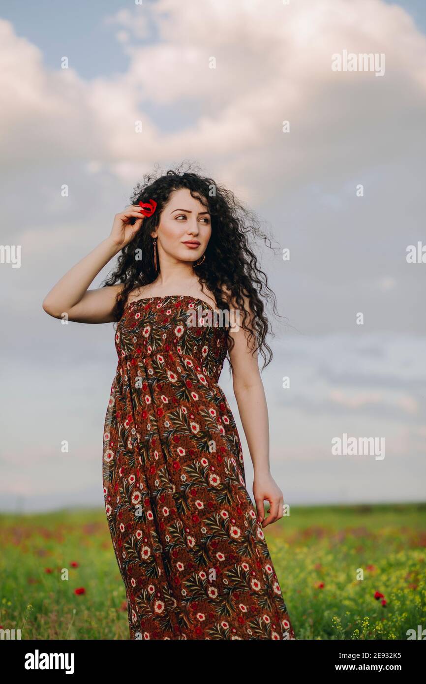 Curly hair girl flower hi-res stock photography and images - Alamy