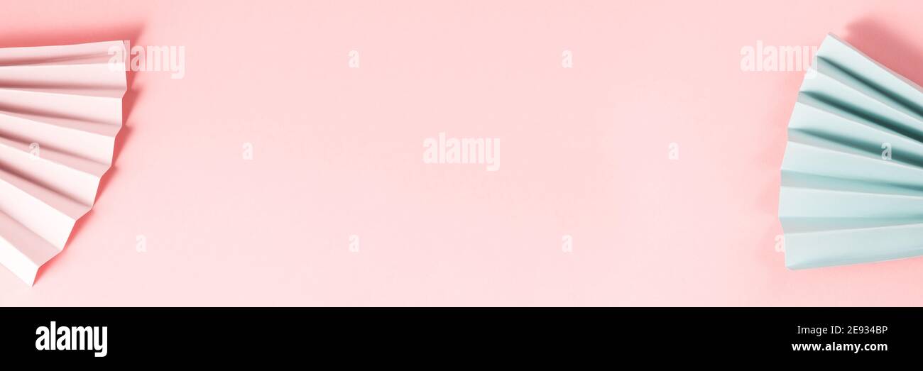 Pastel color paper fans on pink background, web banner Stock Photo - Alamy