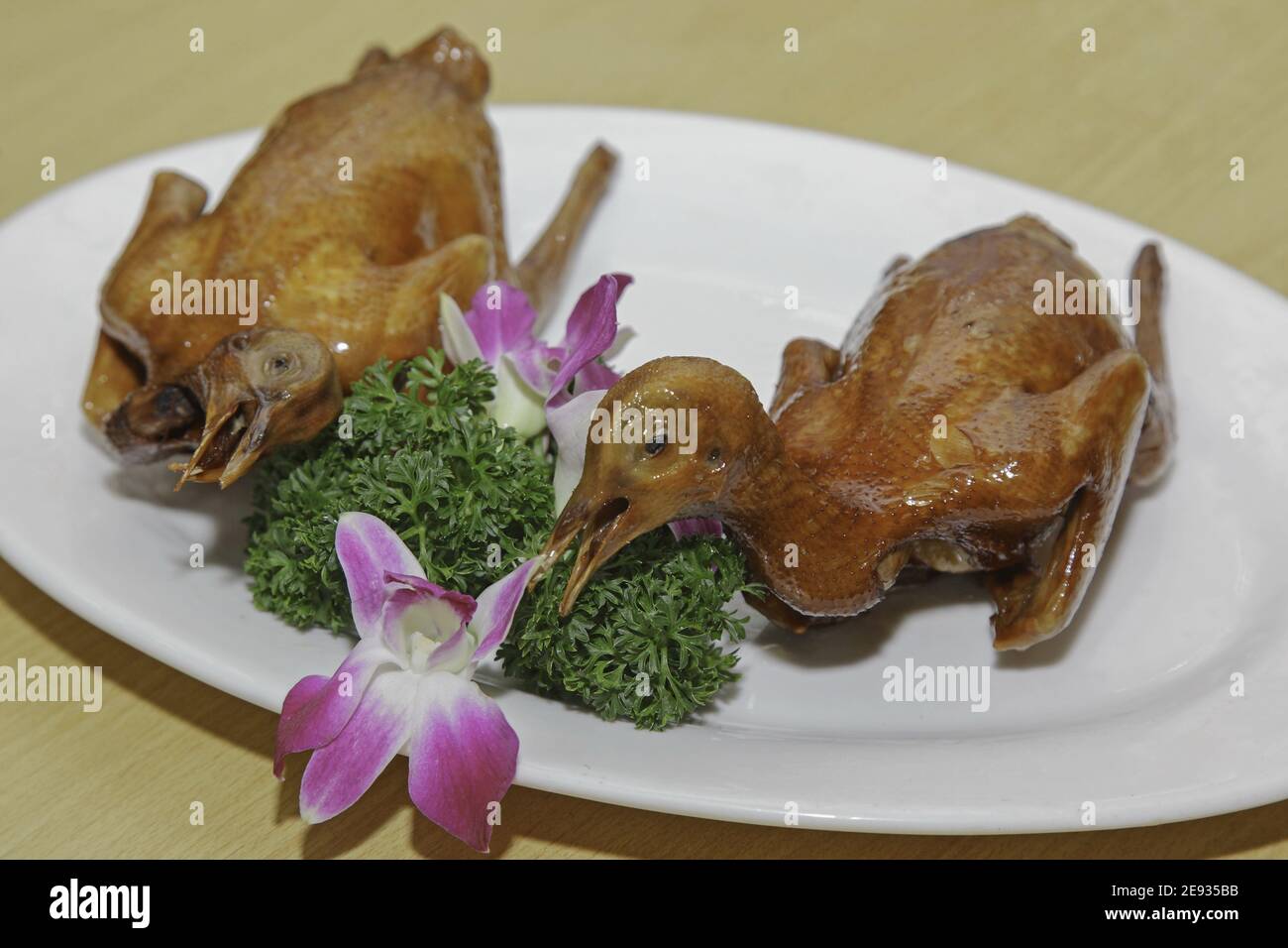 Pigeon braise in soy sauce pork Stock Photo - Alamy