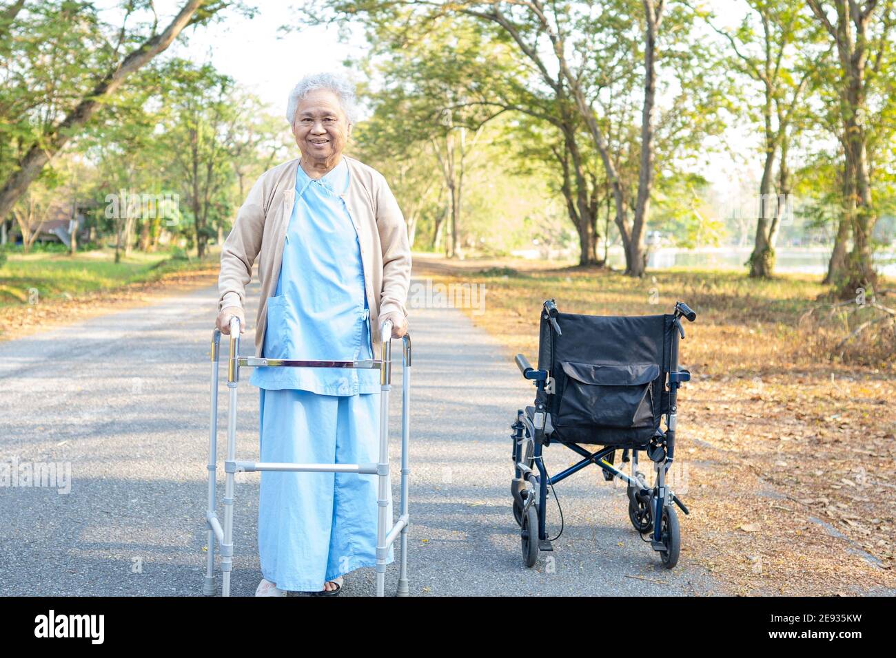 Asian senior or elderly old lady woman use walker with strong health ...