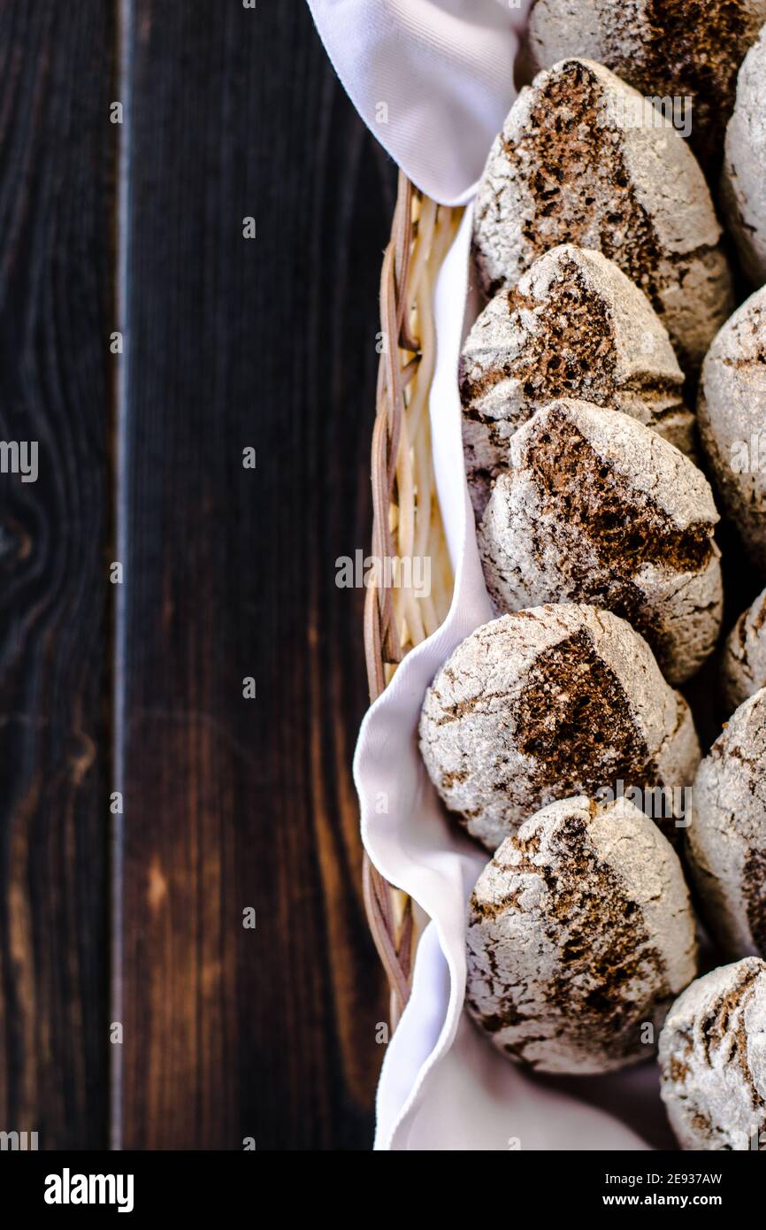 Small rye bread loafs in a basket at a restaurant Stock Photo - Alamy