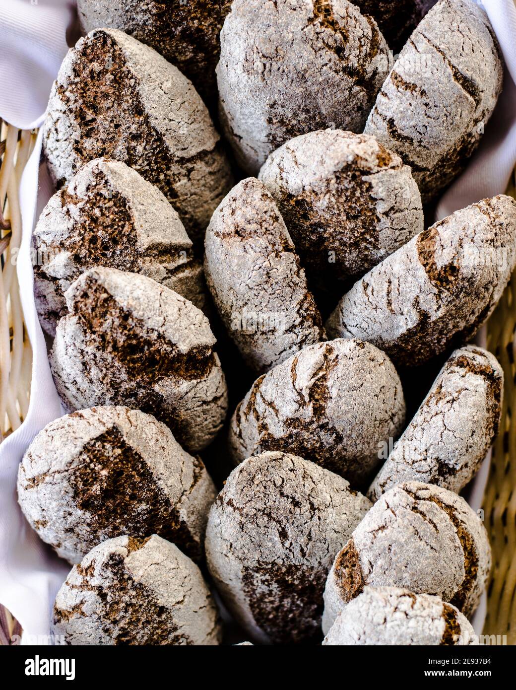 Small rye bread loafs in a basket at a restaurant Stock Photo - Alamy