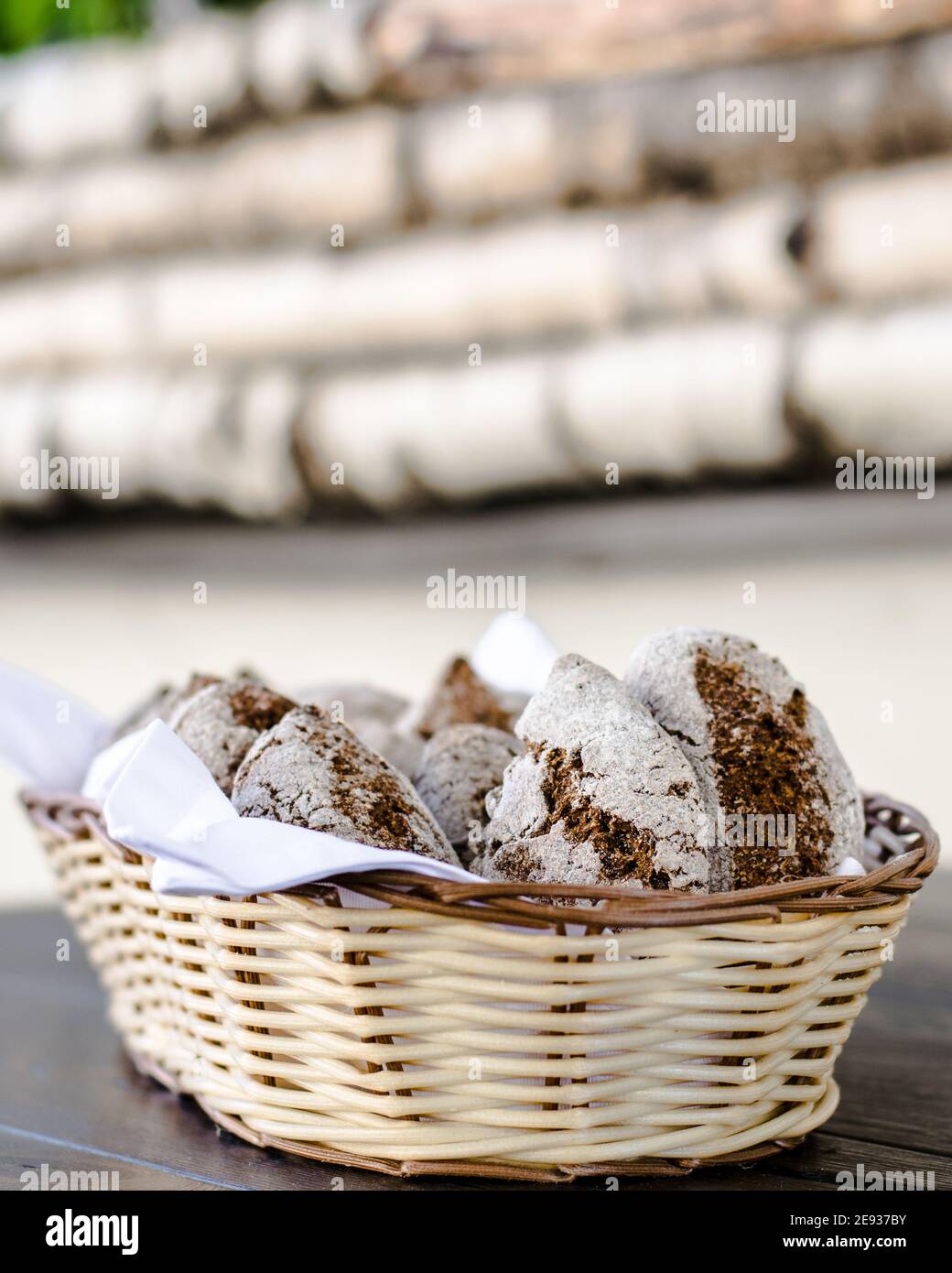 Small rye bread loafs in a basket at a restaurant Stock Photo - Alamy