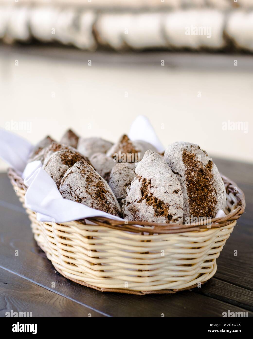 Small rye bread loafs in a basket at a restaurant Stock Photo - Alamy