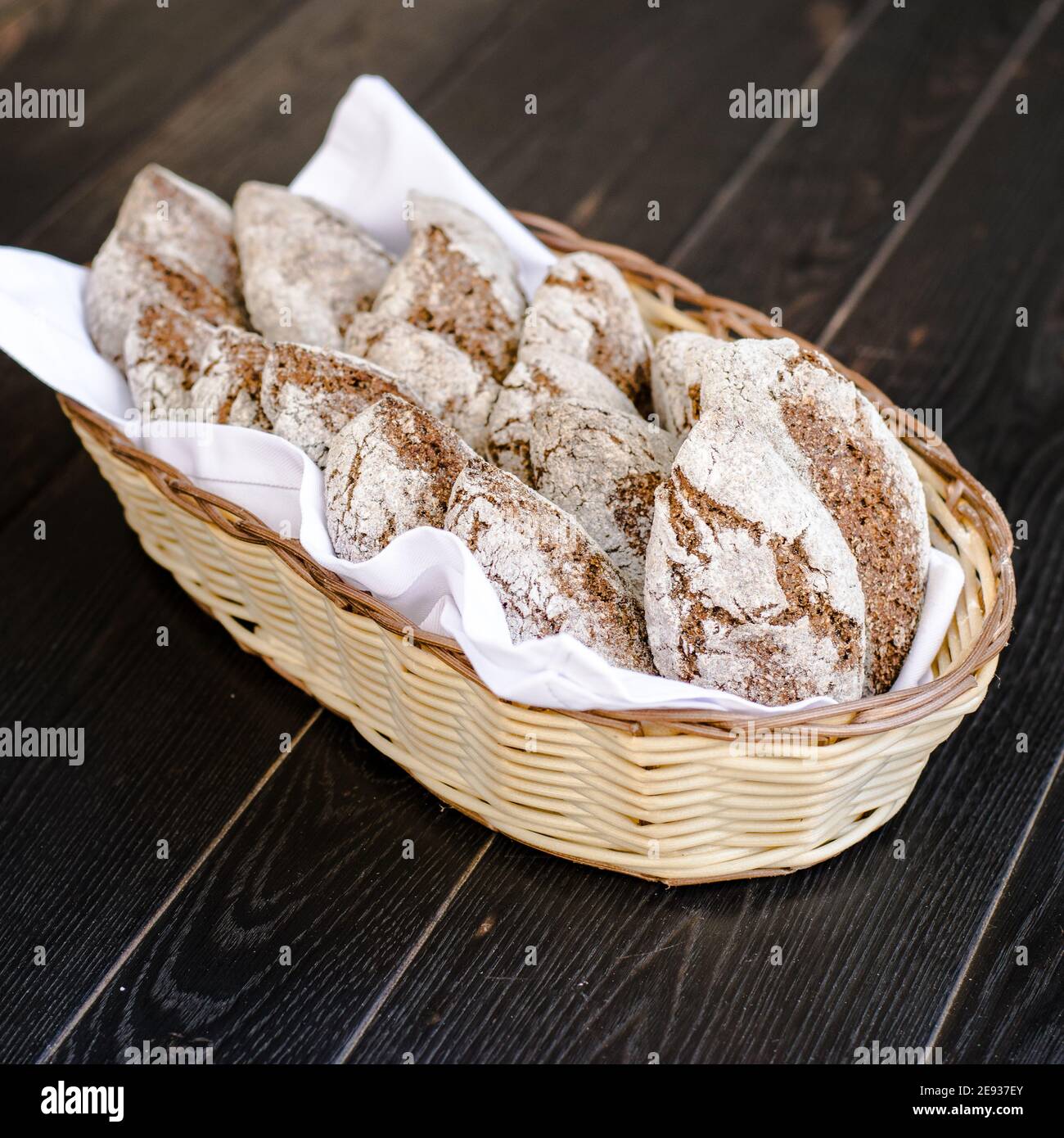 Small rye bread loafs in a basket at a restaurant Stock Photo - Alamy
