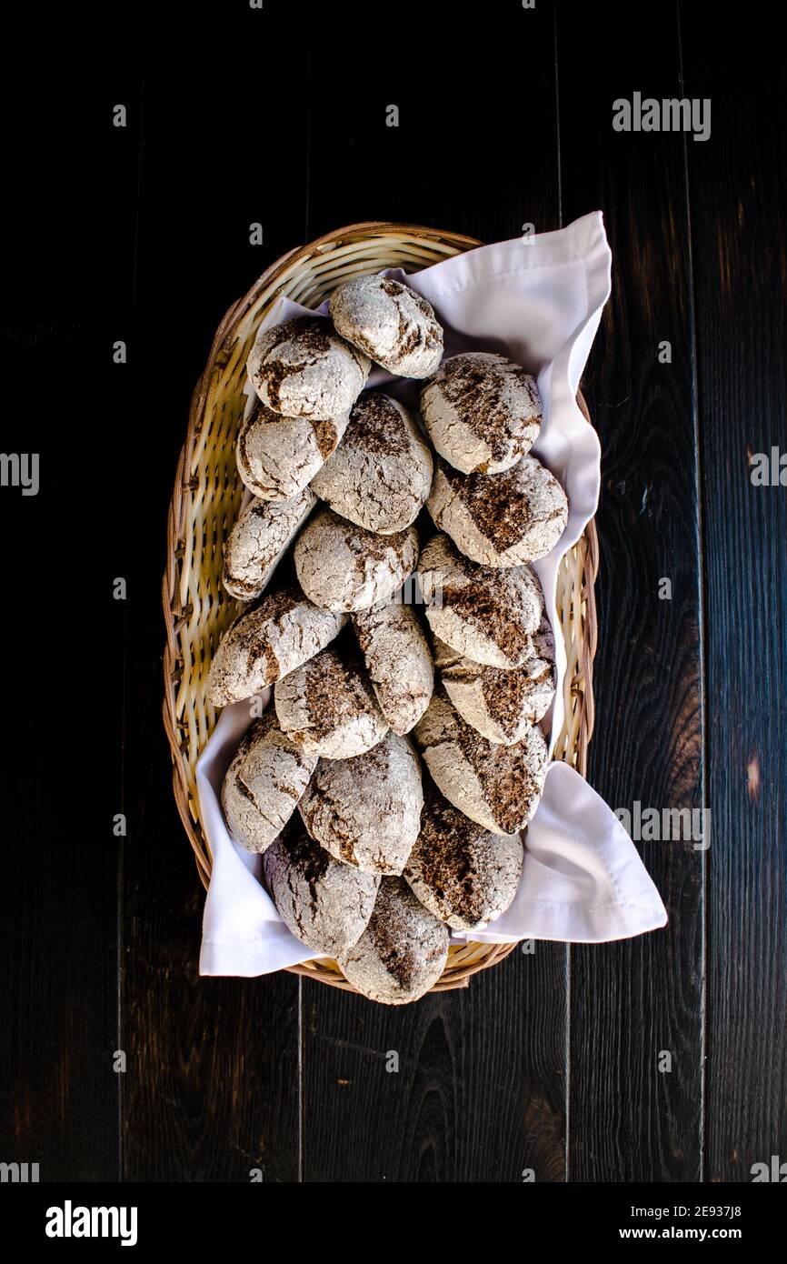 Small rye bread loafs in a basket at a restaurant Stock Photo - Alamy