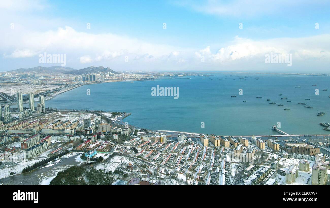 Snow covers the Shidao Bay during the first snowfall of the New Year ...