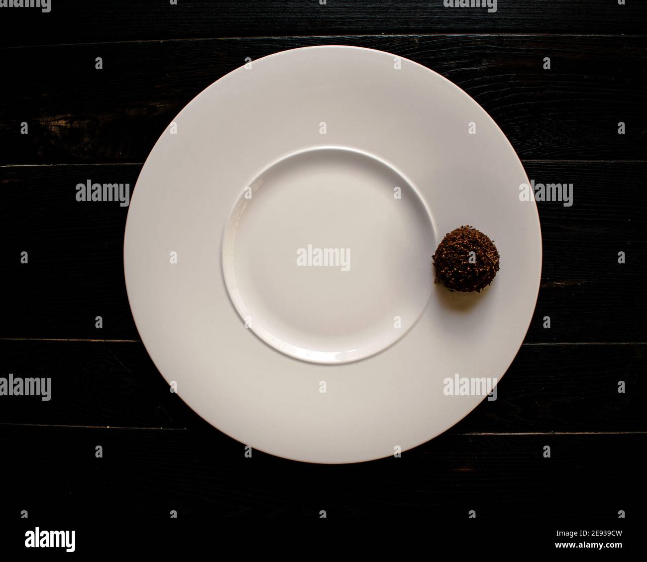 Chocolate truffle, single, on a plate at a restaurant Stock Photo - Alamy