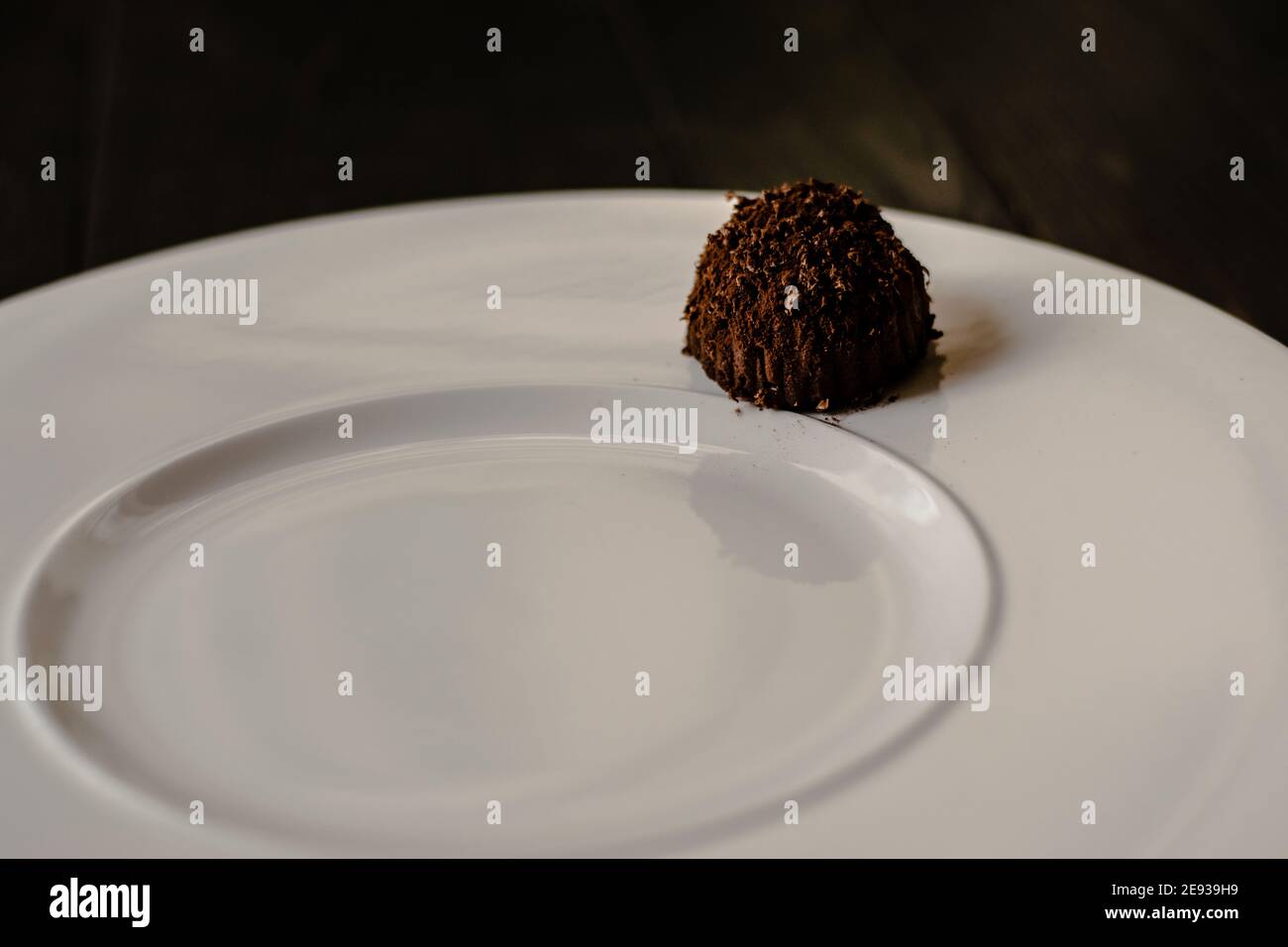 Chocolate truffle, single, on a plate at a restaurant Stock Photo - Alamy