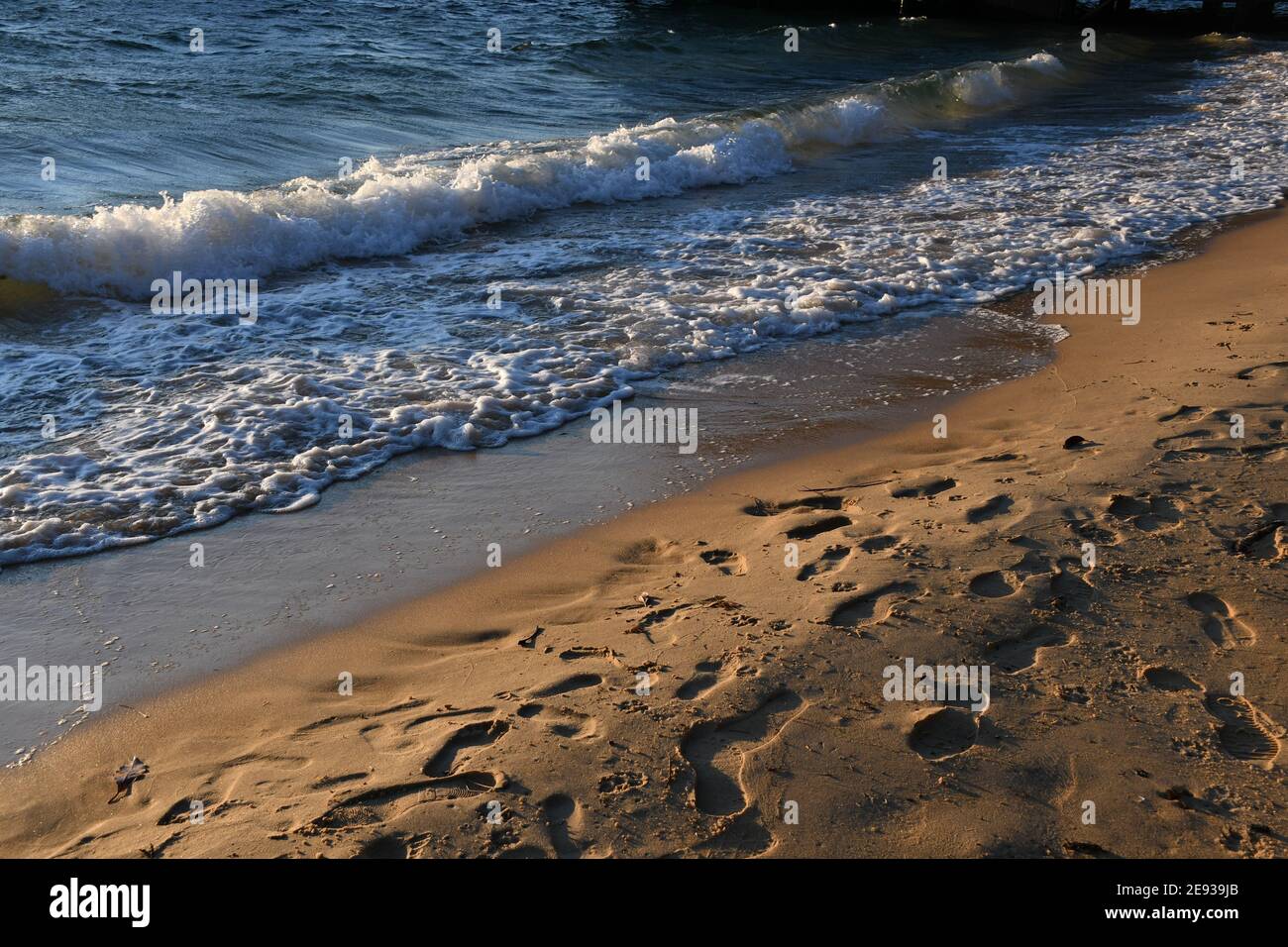 Aerial view of sea waves lash line impact rock on the beach in Sydney ...