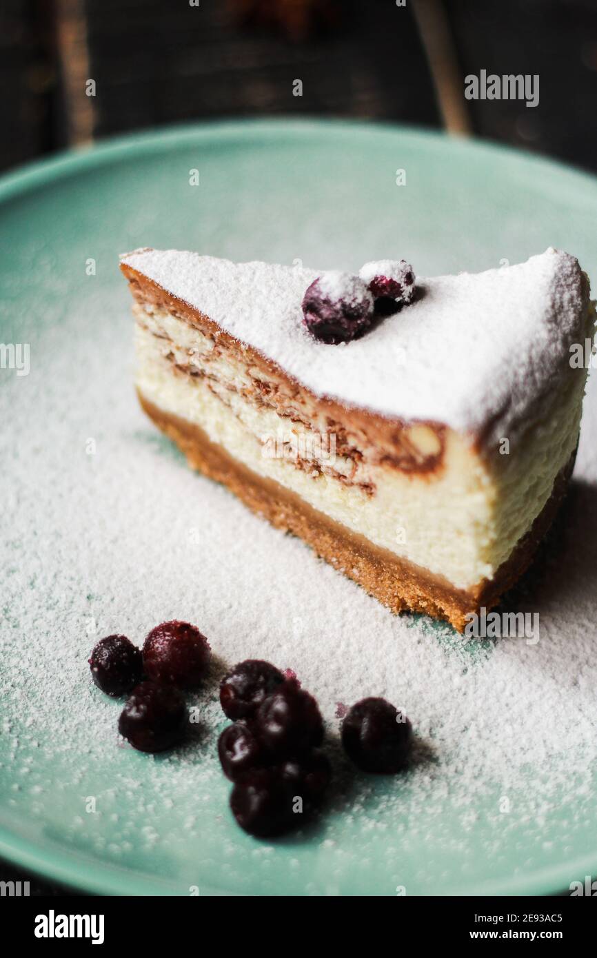 Vertical closeup shot of a piec of cake on plate Stock Photo - Alamy