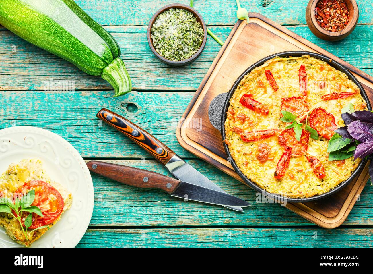 Delicious zucchini and tomato omelet on plate.Summer snack Stock Photo ...