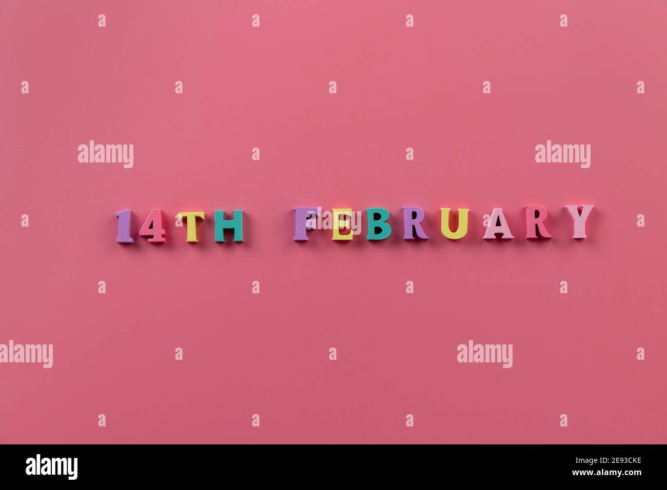 The word "14th February" banner. Multicolored letters on pink ...