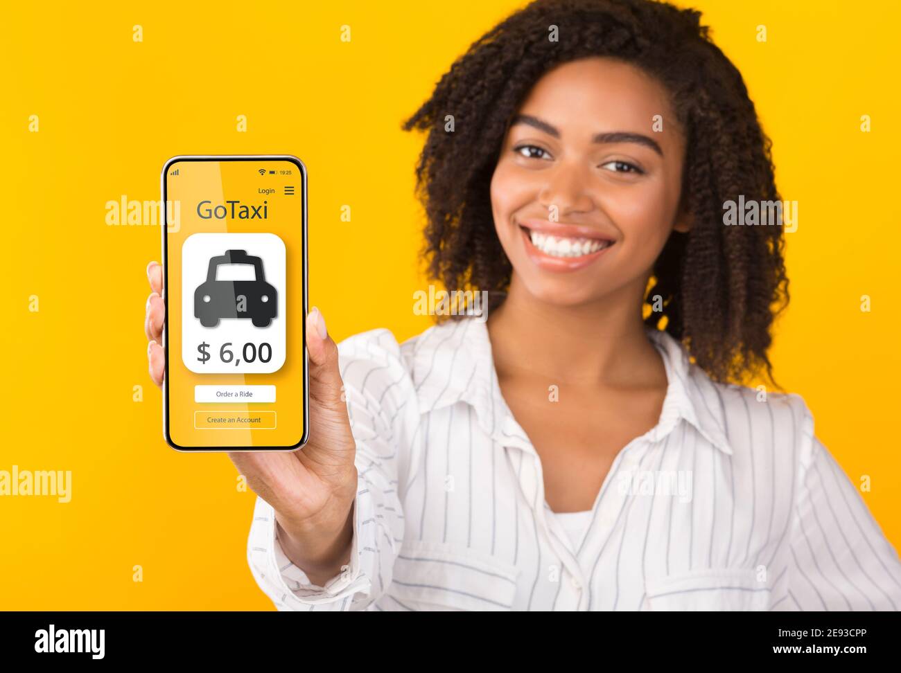 Black woman recommending mobile taxi service, showing smartphone with ...