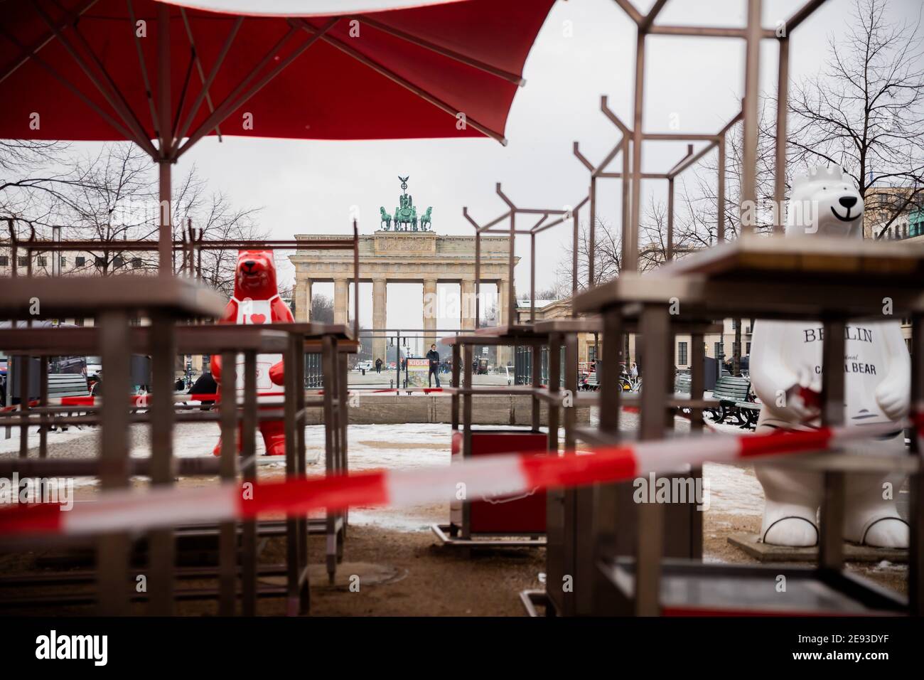 02 February 2021, Berlin: Tables from a currywurst stand are stacked up ...