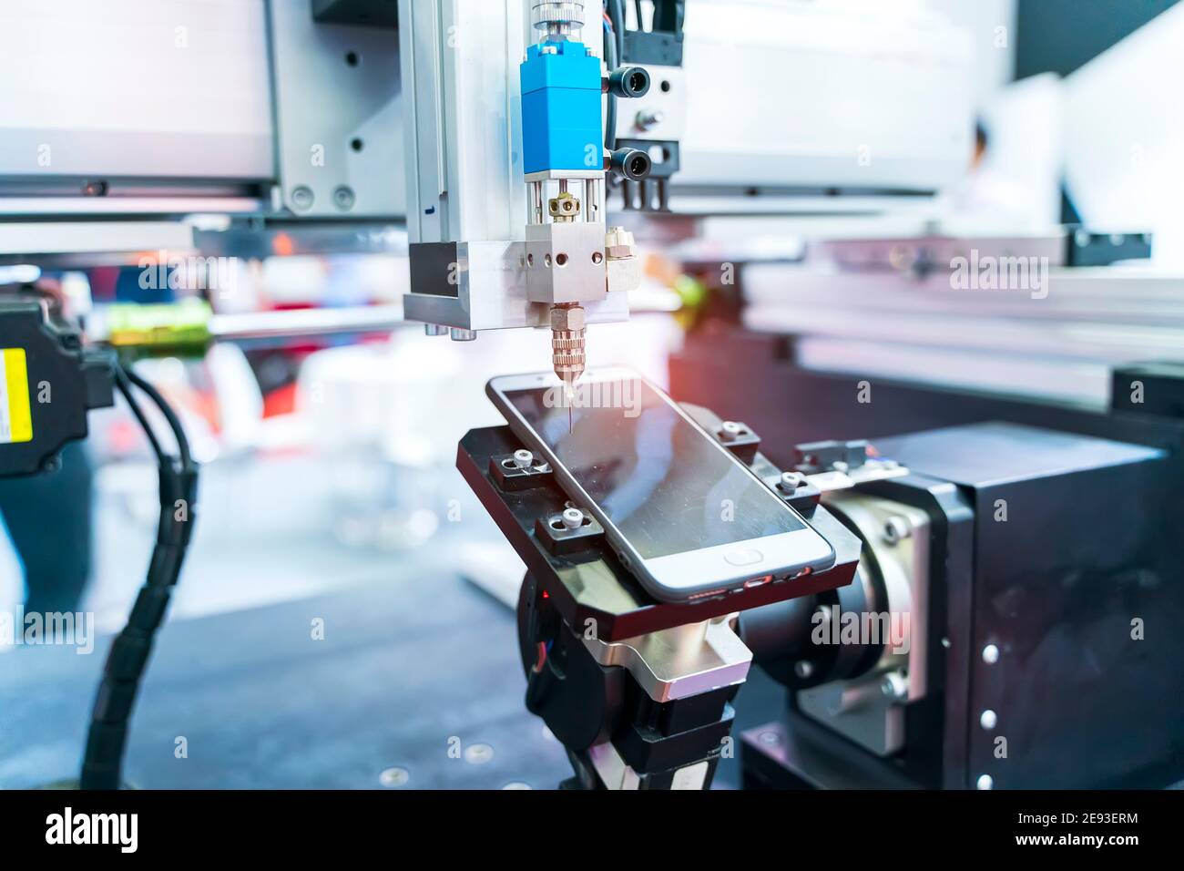 automaitc holding glue syringe Injection in mobile phone factory Stock ...