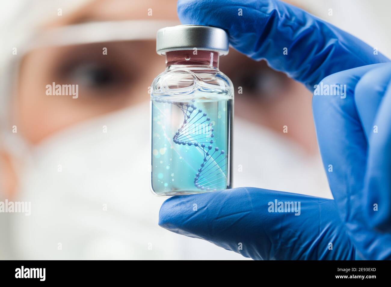 UK lab scientist biotechnologist holding glass ampoule vial with DNA ...