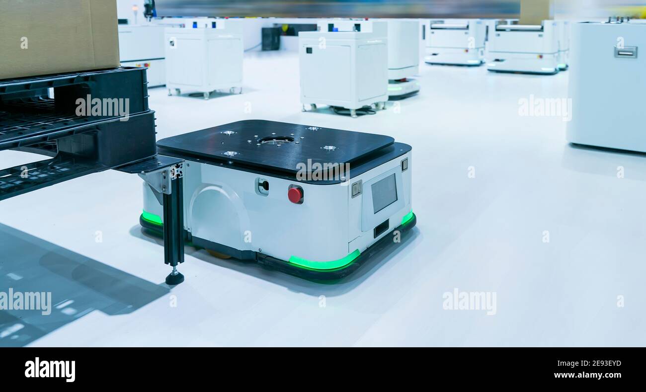 warehouse robot car carries cardboard box assembly in factory Stock ...