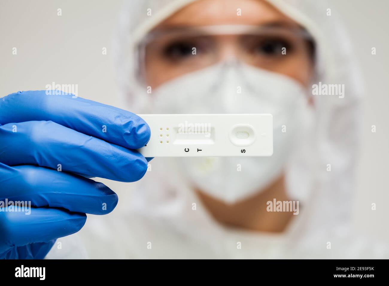 Healthcare UK NHS frontliner holding Coronavirus COVID-19 rapid ...