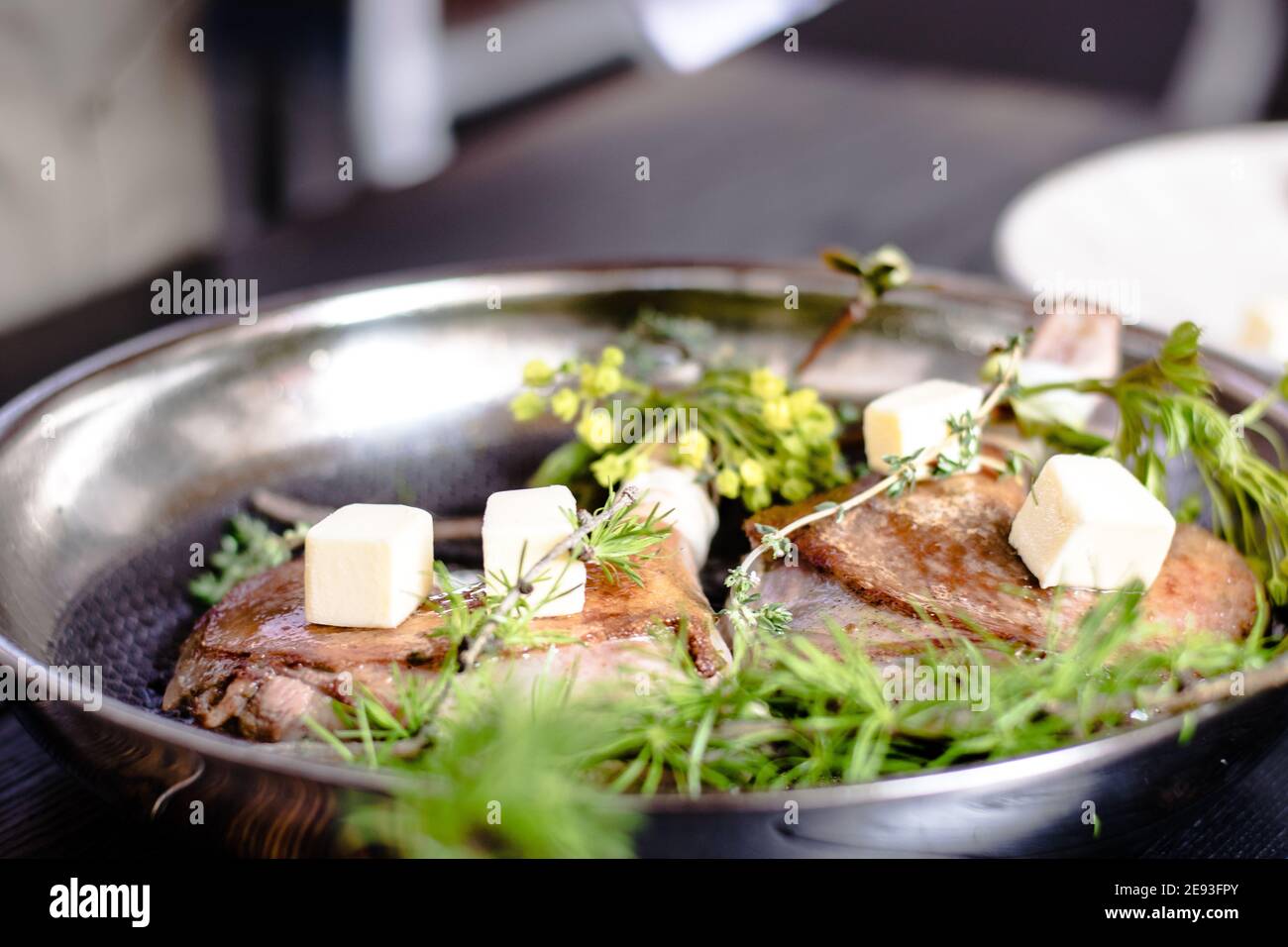 Chef preparing quail in a pan at a restaurant Stock Photo - Alamy