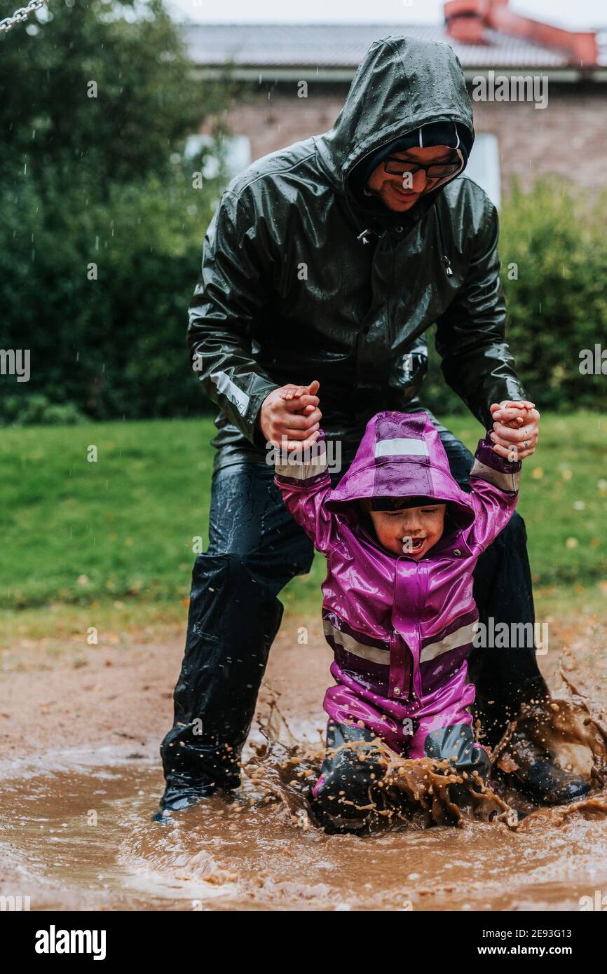 Child puddle adult splash hi-res stock photography and images - Alamy