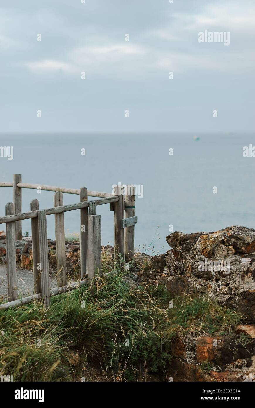 Landscape of the cliff protected with wooden railing overlooking the ...