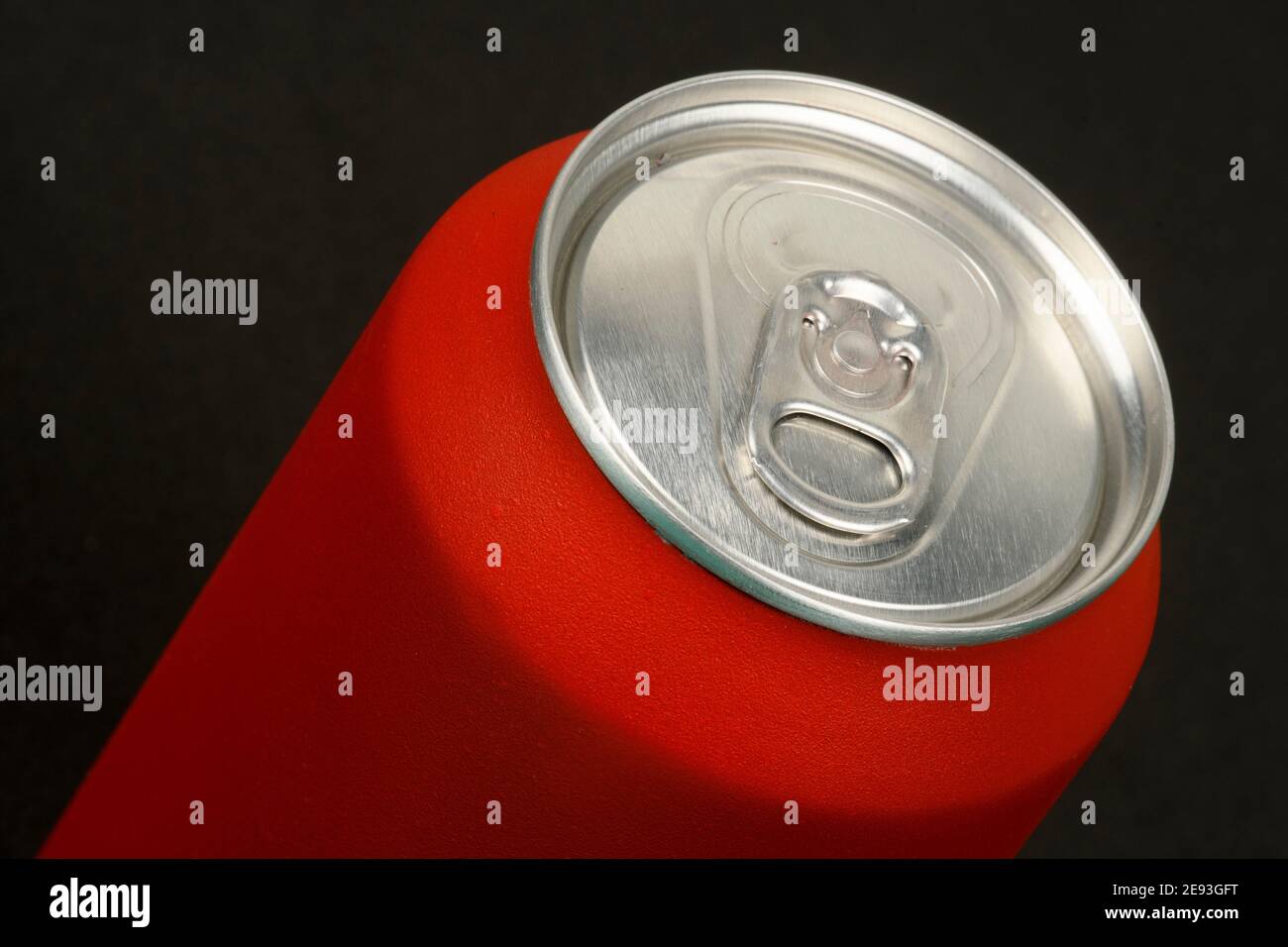 red soda cans on light black background Stock Photo - Alamy