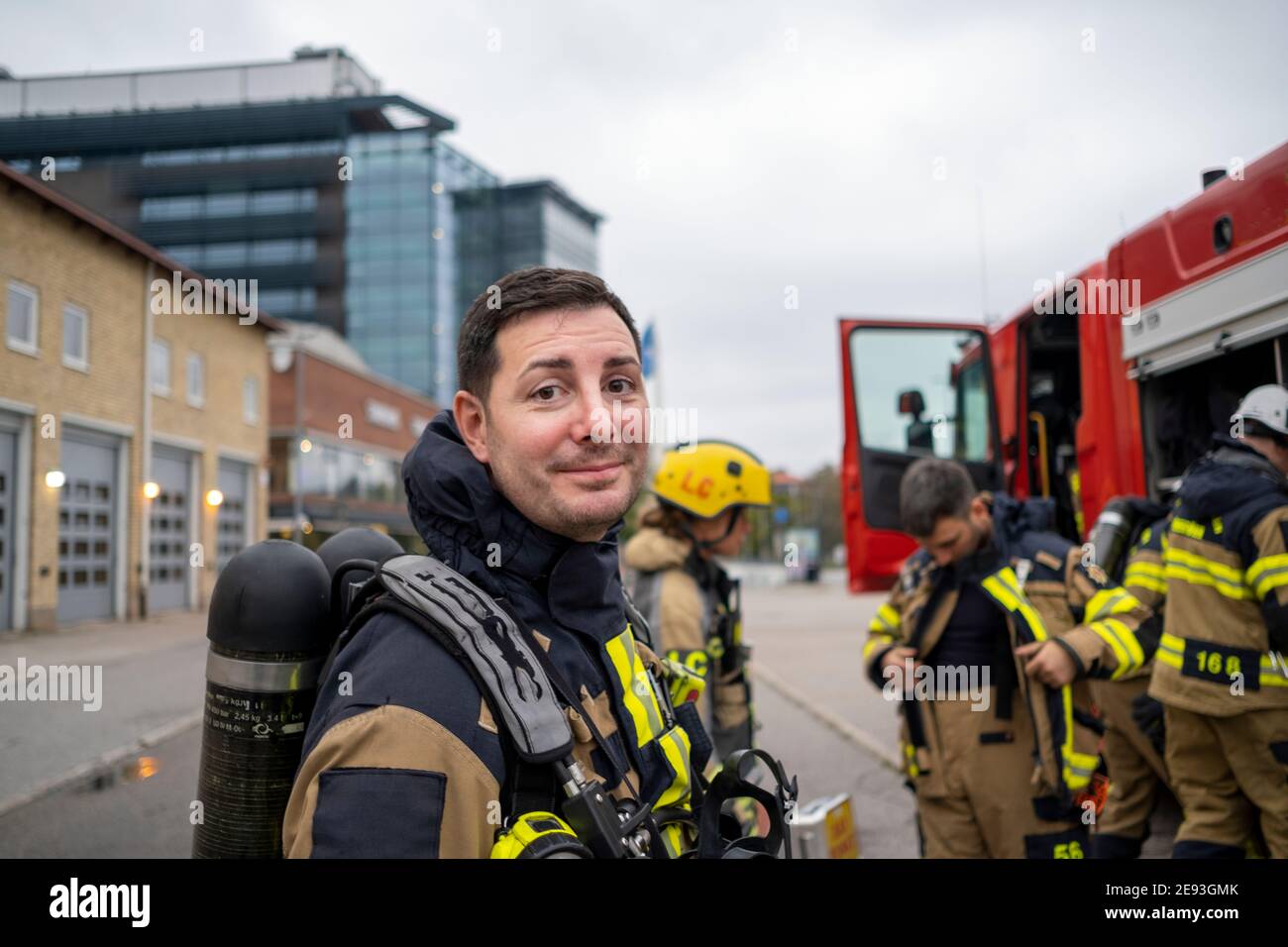 Male firefighter looking at camera Stock Photo - Alamy