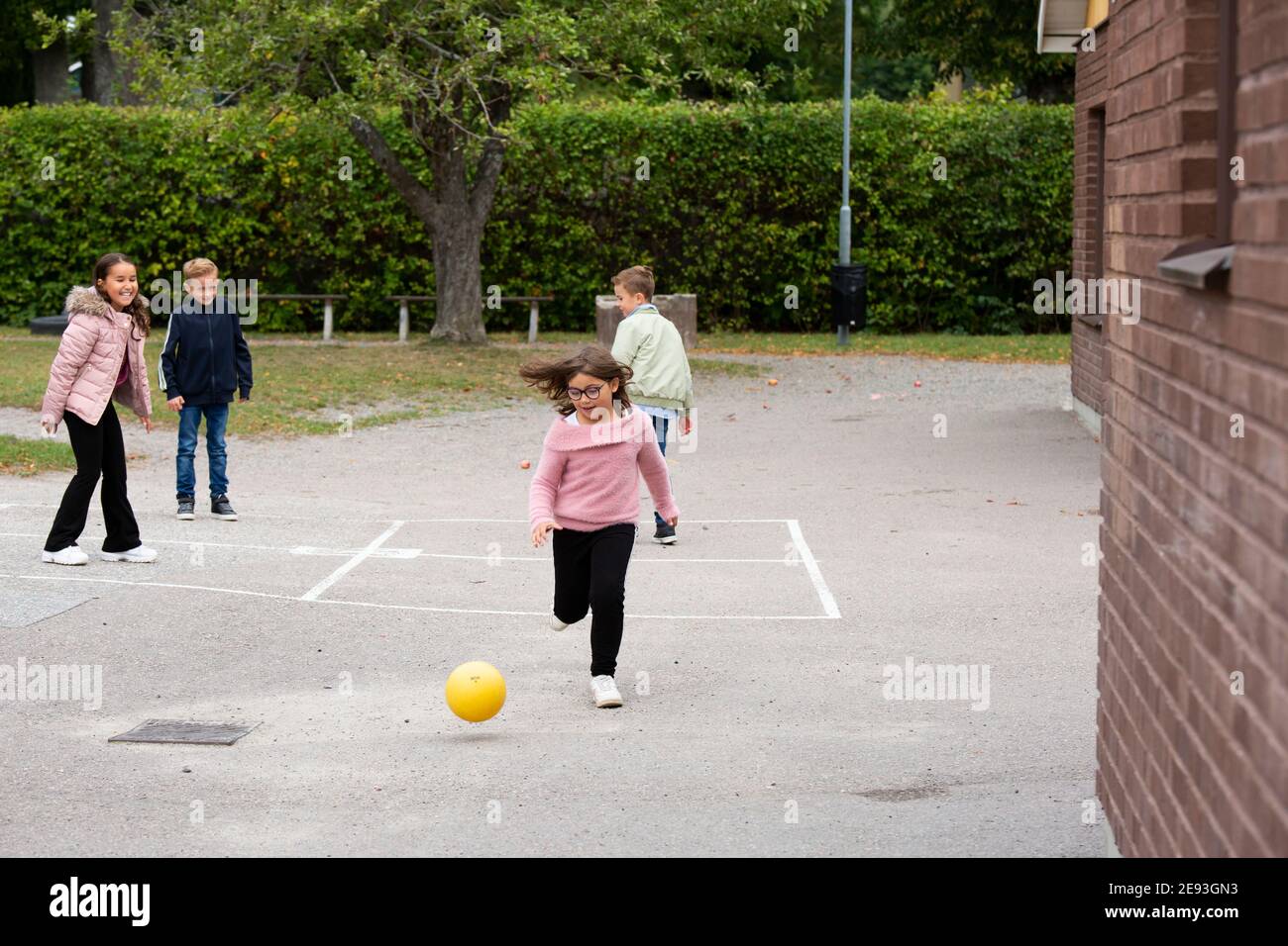 Children playing at school yard Stock Photo - Alamy
