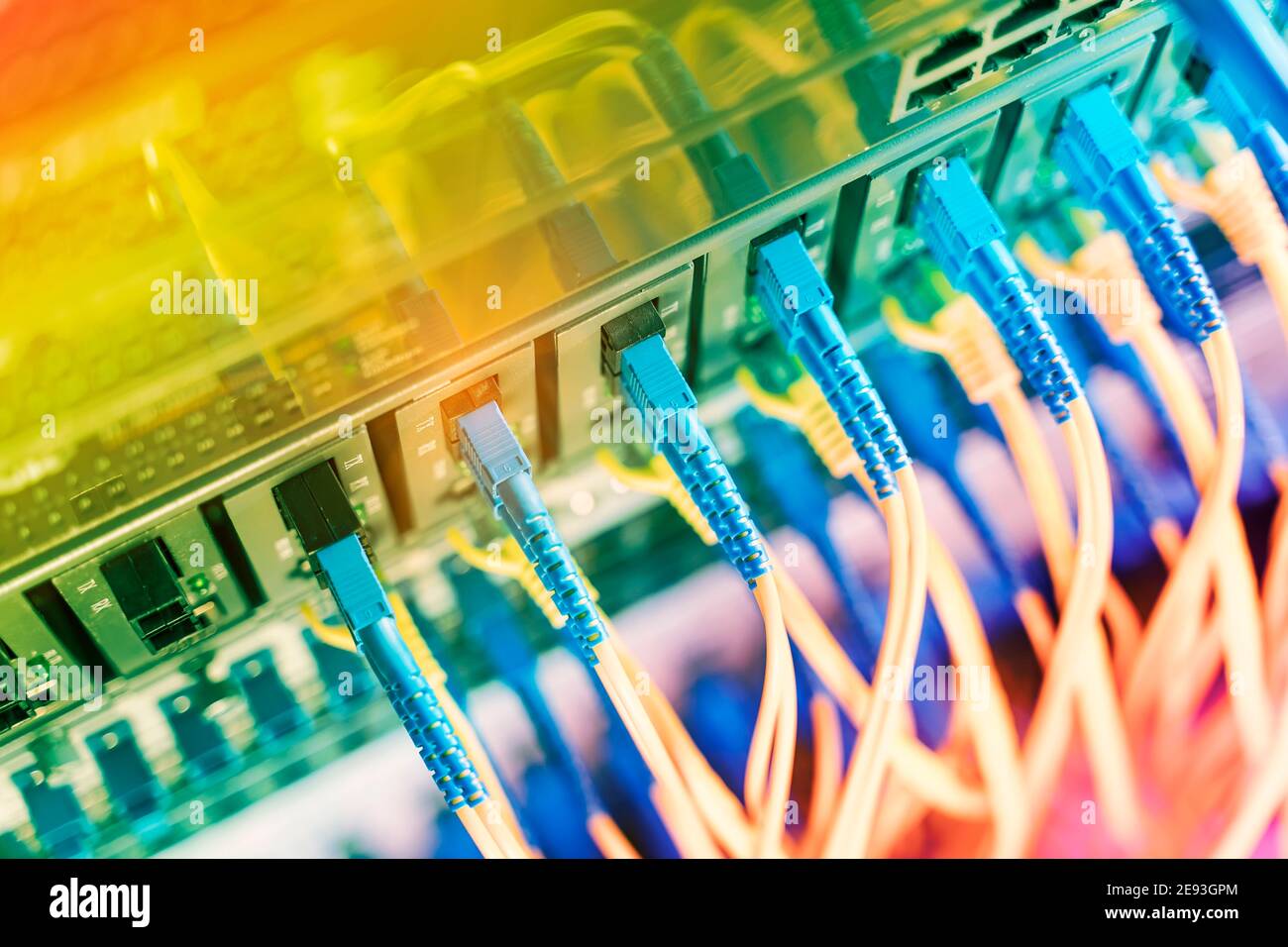 Fiber Optic cables connected to optic ports and Network cables ...