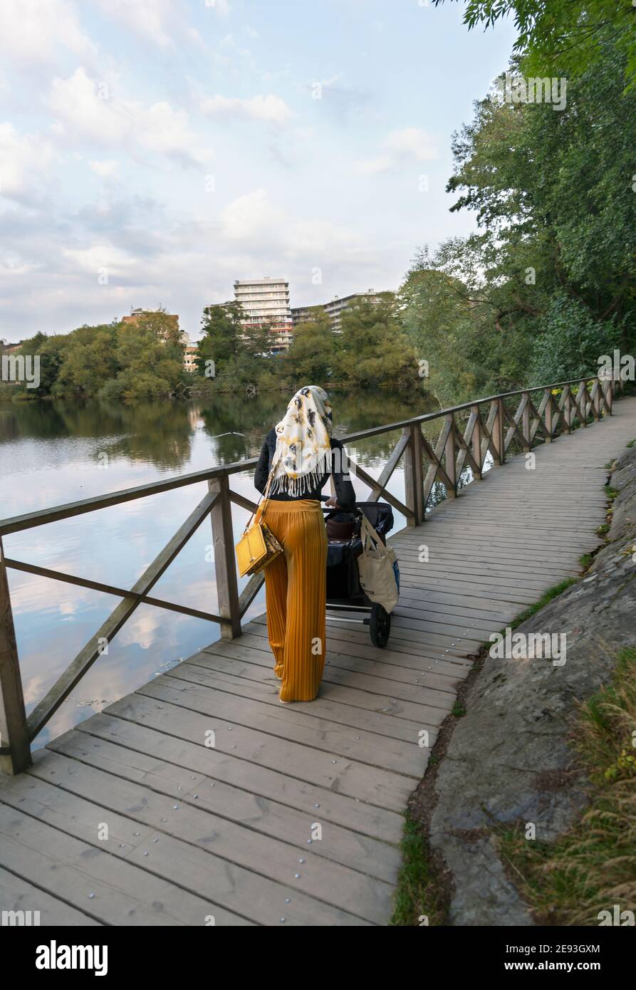 Woman pushing pram hi-res stock photography and images - Alamy