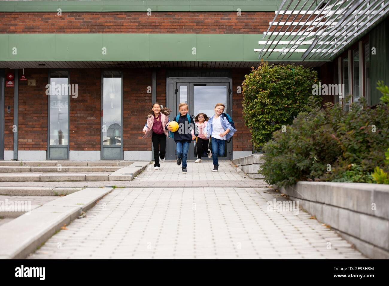 Elementary school children running hi-res stock photography and images ...