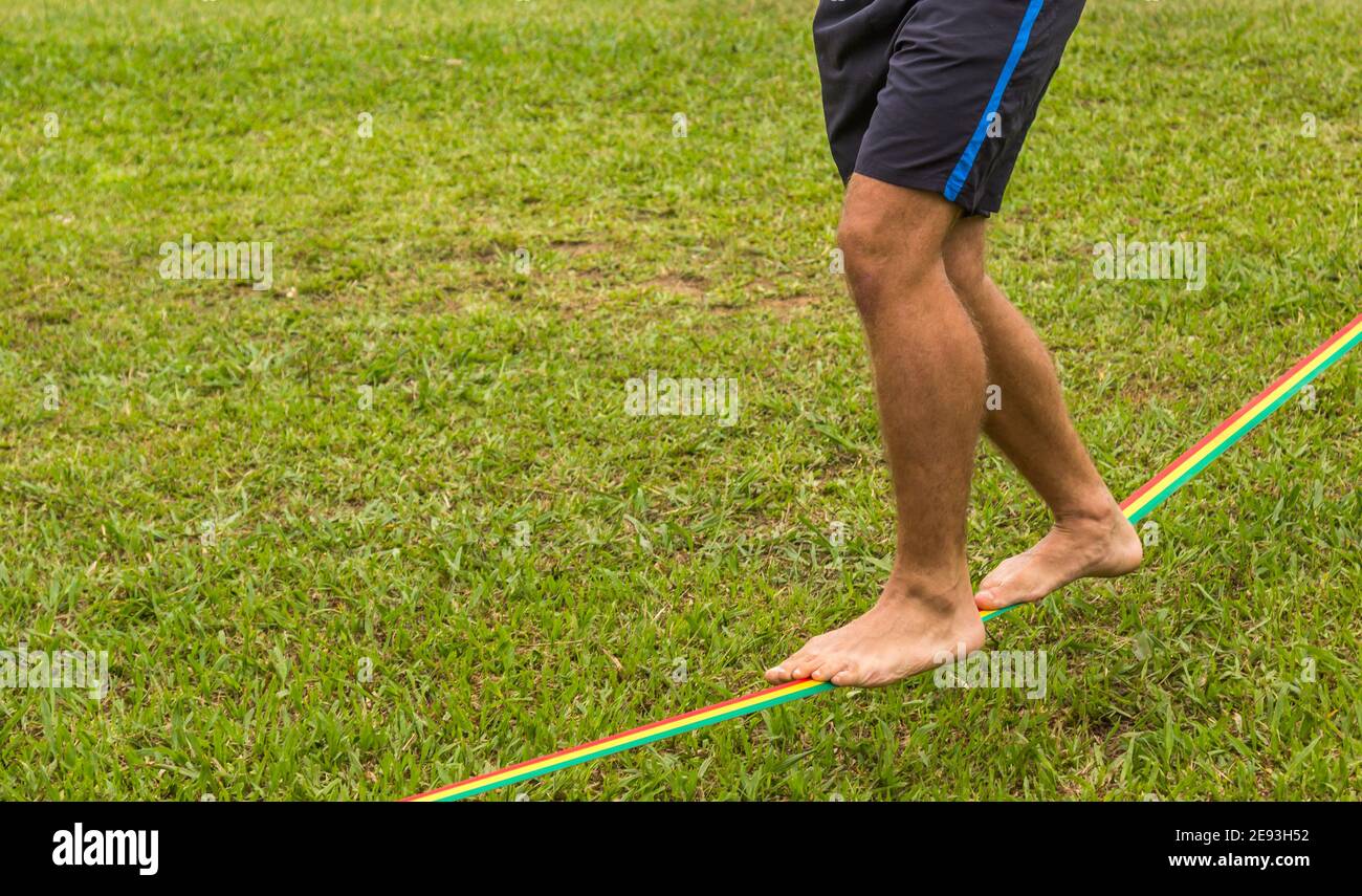 Person slacklining hi-res stock photography and images - Alamy