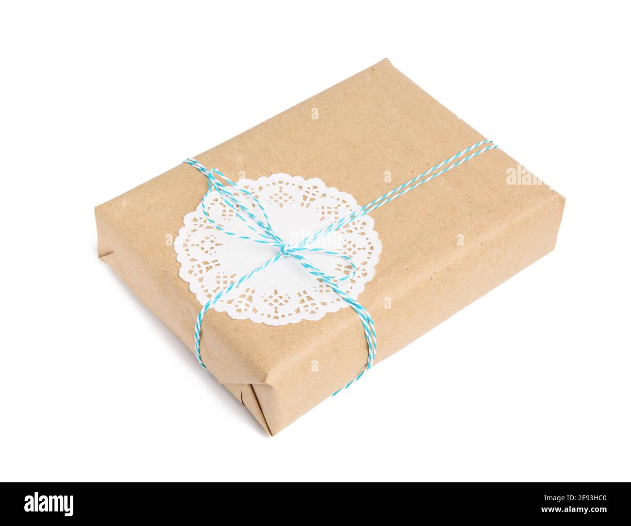 box wrapped in brown kraft paper and tied with blue rope, gift isolated ...